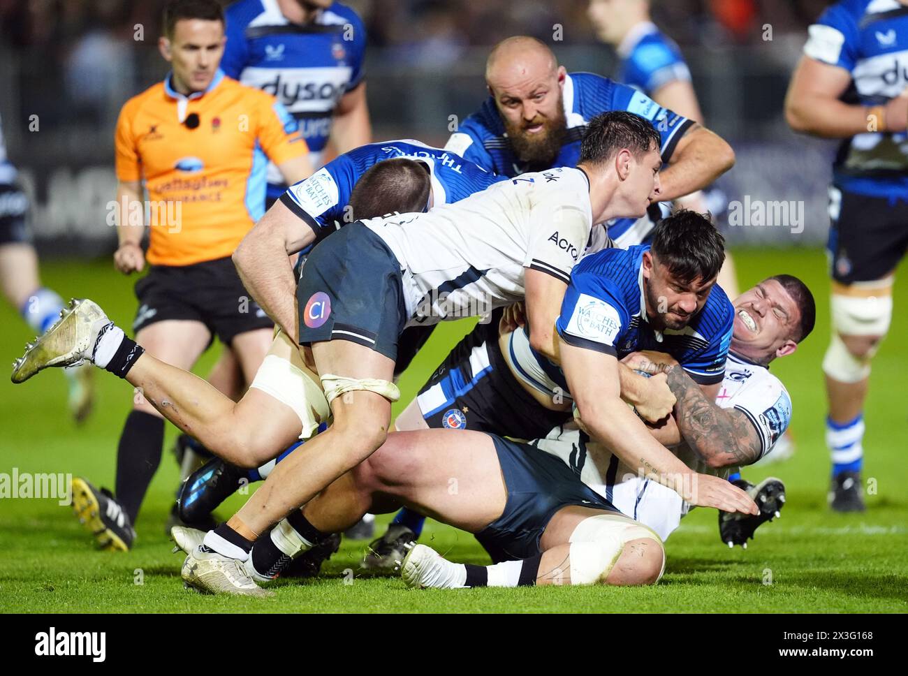 Bath Rugby's Jaco Coetzee is tackled by Saracens' Juan Martin Gonzalez ...