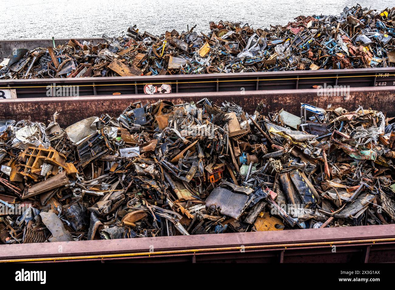 Barges loaded with scrap metal, for recycling, melting down, in the ...