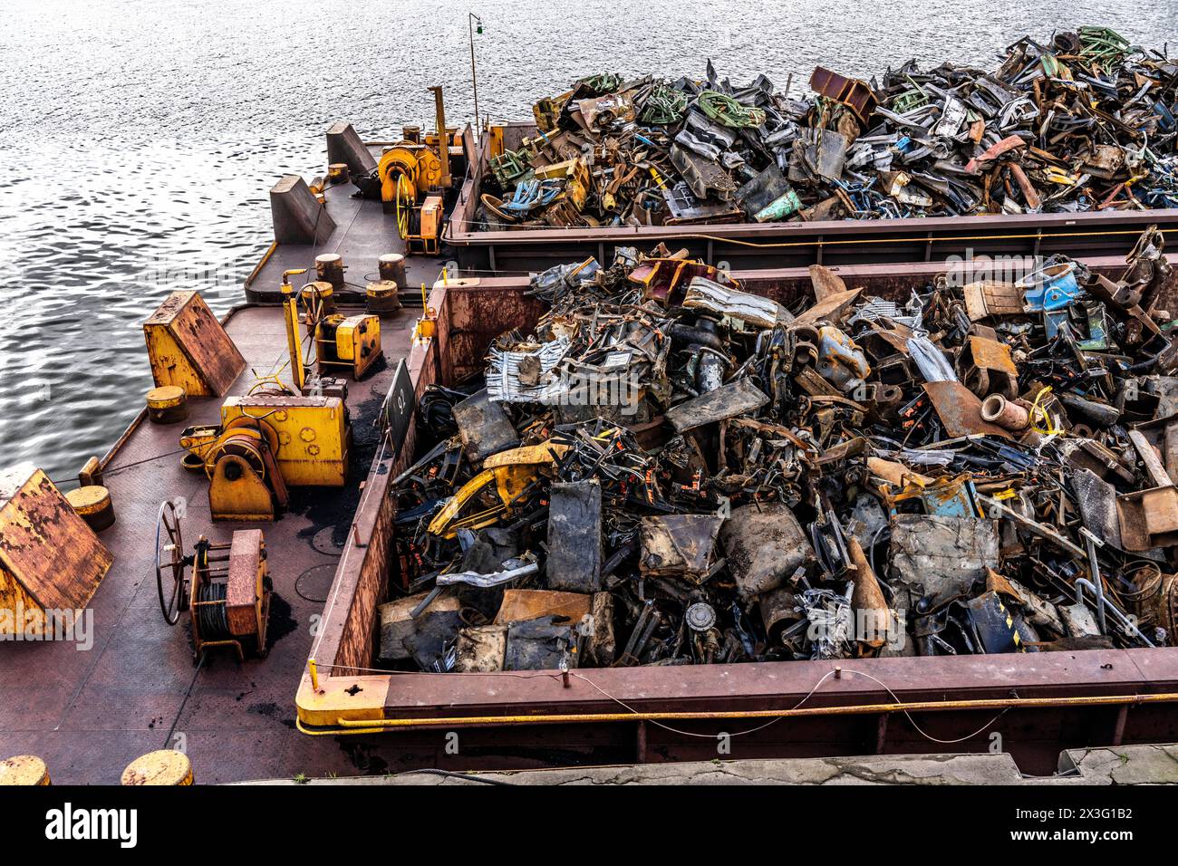 Barges loaded with scrap metal, for recycling, melting down, in the ...