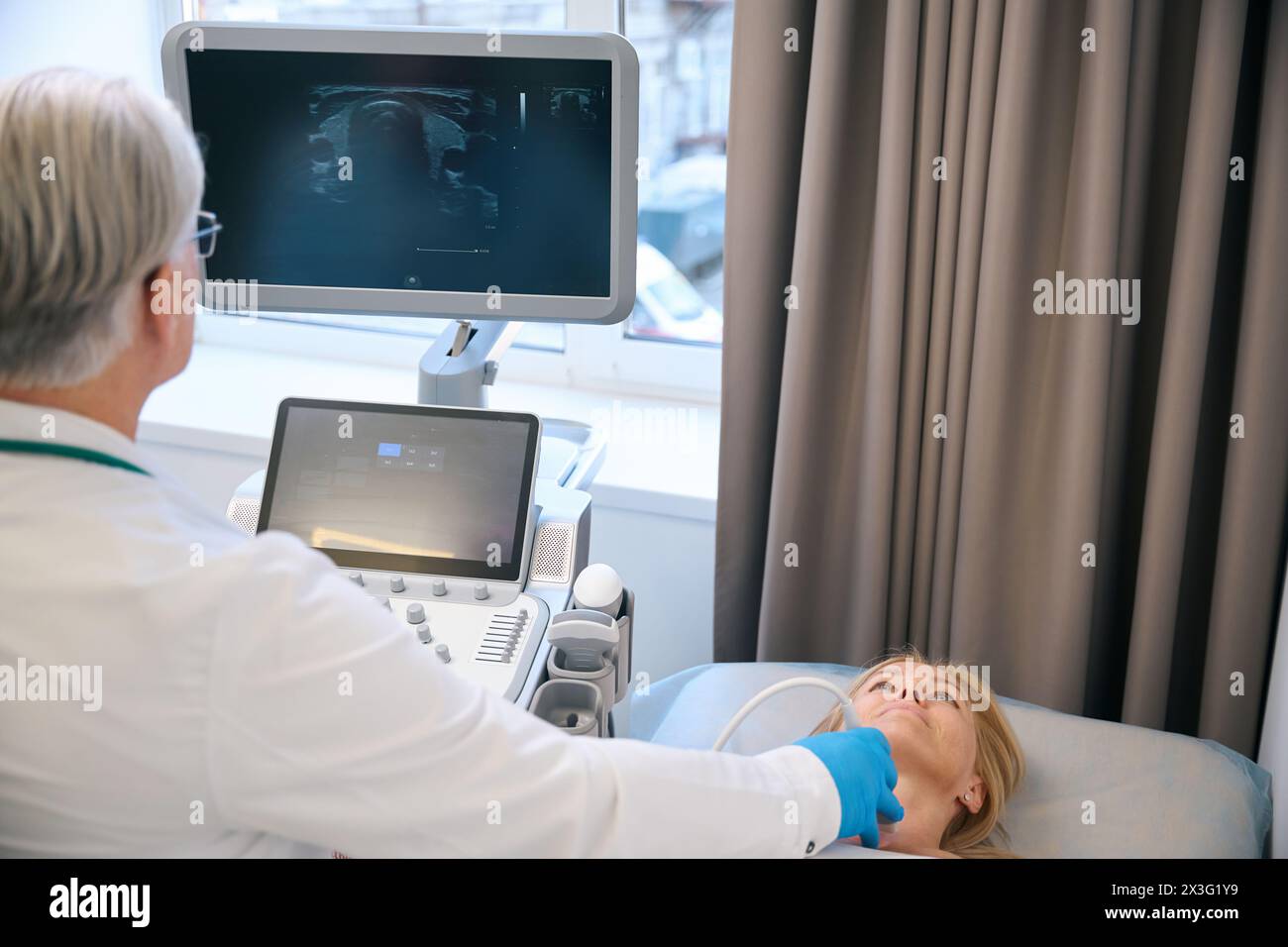 Thyroid exam doctor hi-res stock photography and images - Alamy