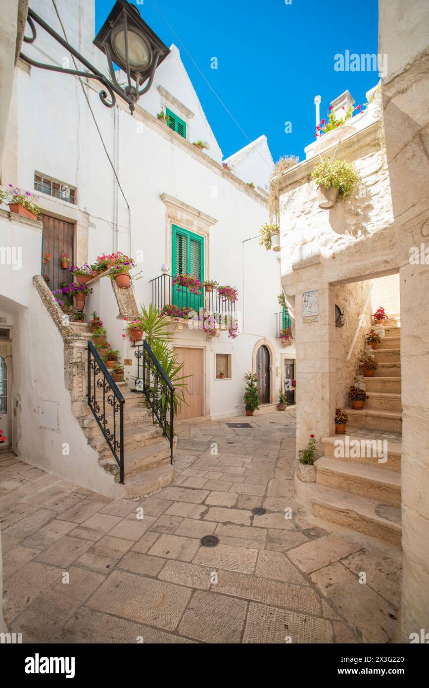 View of narrow historical street of Locorotondo, near Bari Stock Photo ...