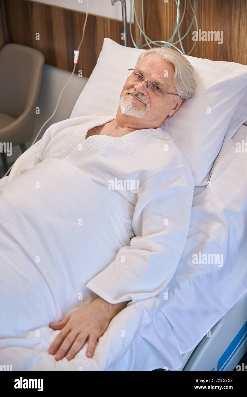 Hospitalized mature male lying in hospital ward Stock Photo - Alamy
