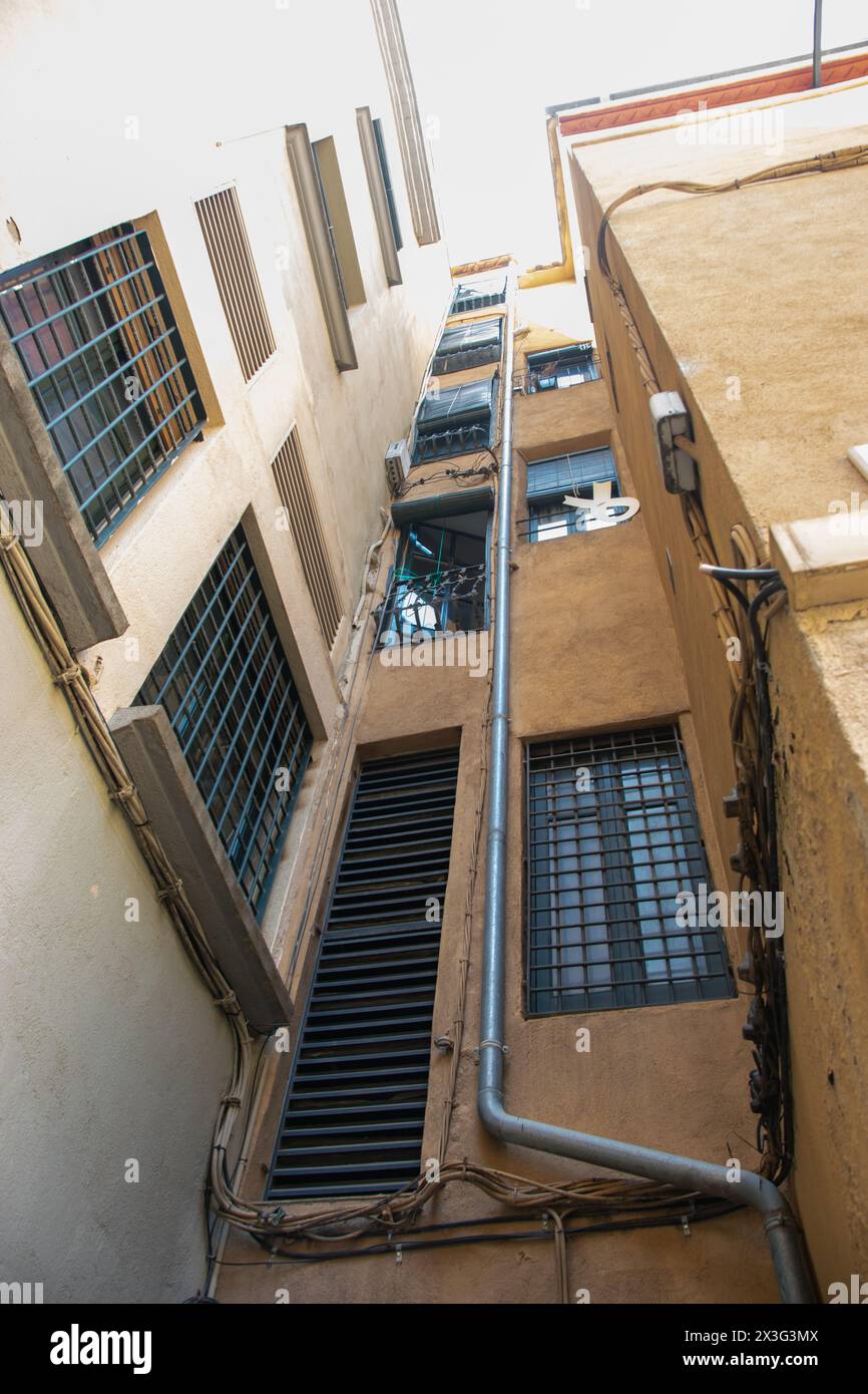 Look above from backyard of an old house to the roof opening with ...