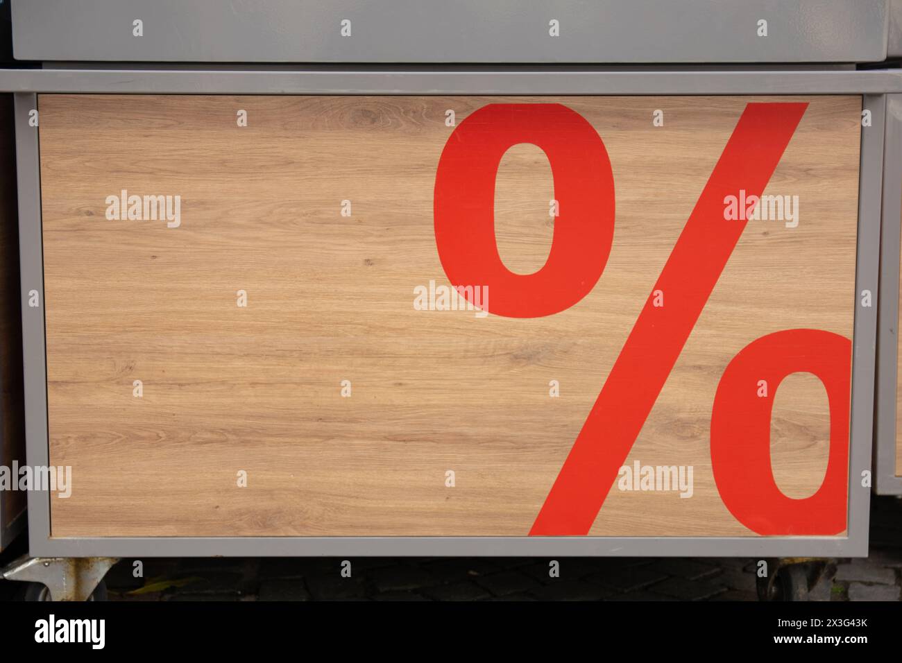 Sale sign outside store on the street. Wood background Stock Photo - Alamy