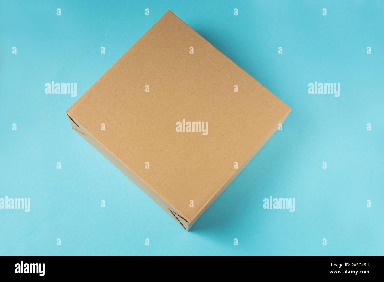 Eco cardboard box on blue background. Mockup for design Stock Photo - Alamy