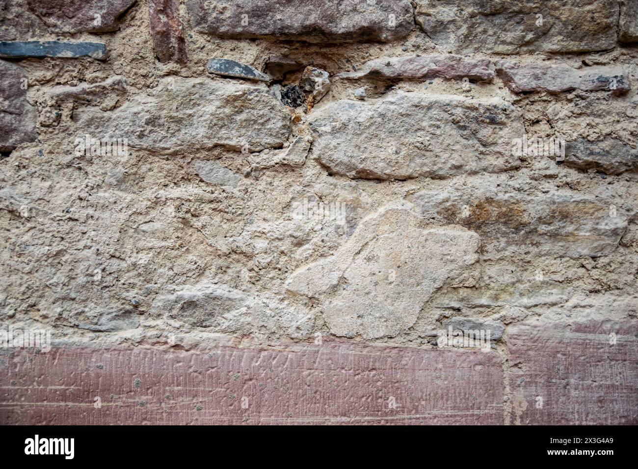 Structural stone wall of the ancient building. Gray stone tile block ...