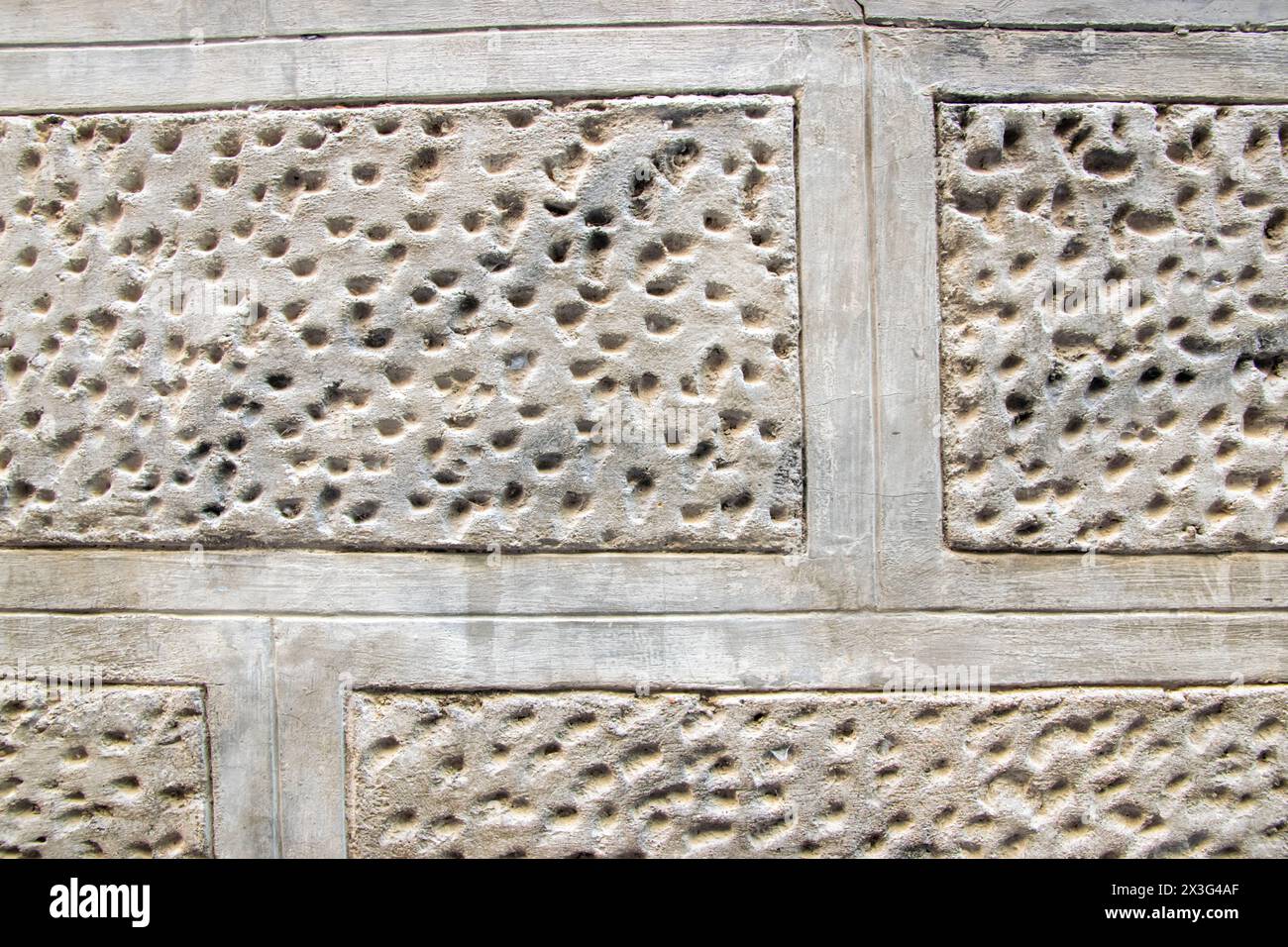 Structural stone wall of the ancient building. Gray stone tile block ...