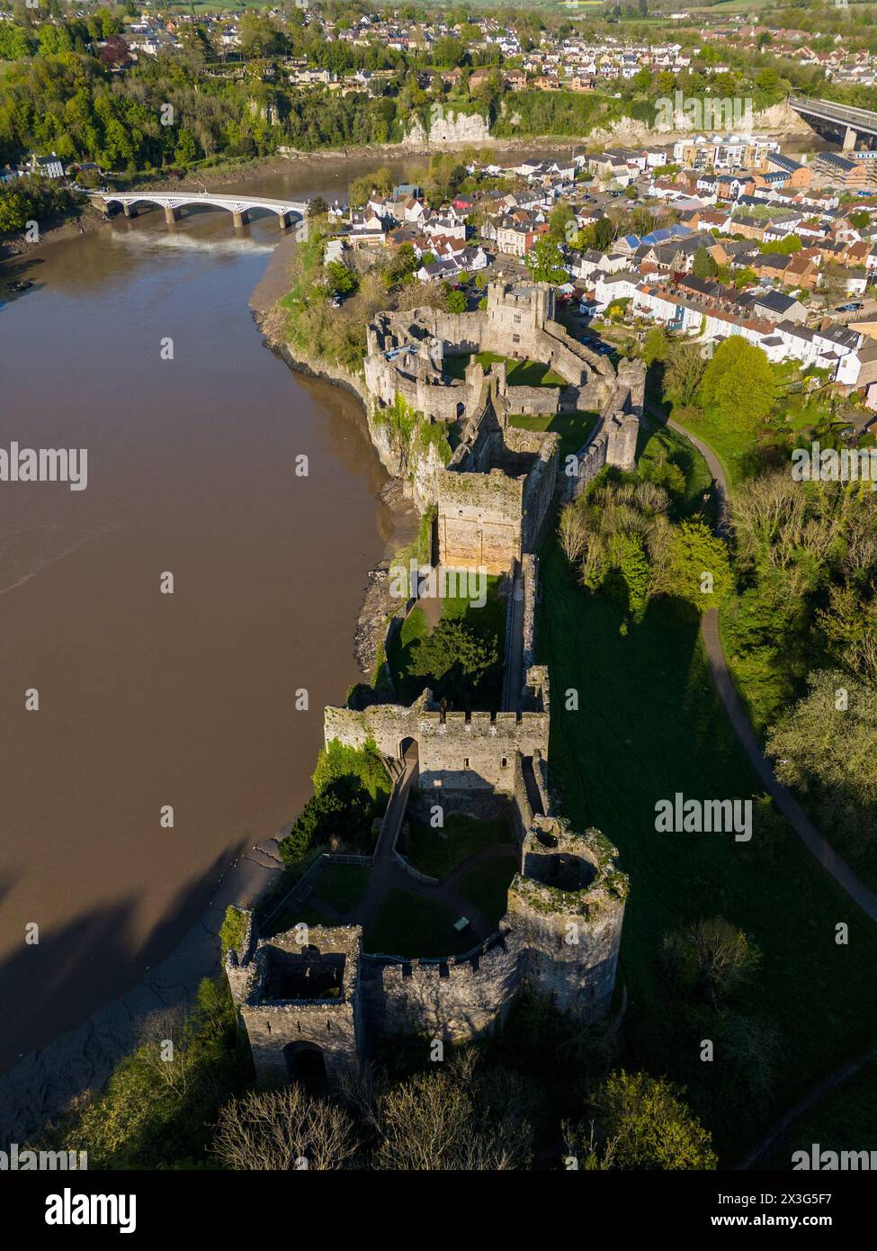 Aerial shot showcasing the grandeur of an ancient castle alongside a ...