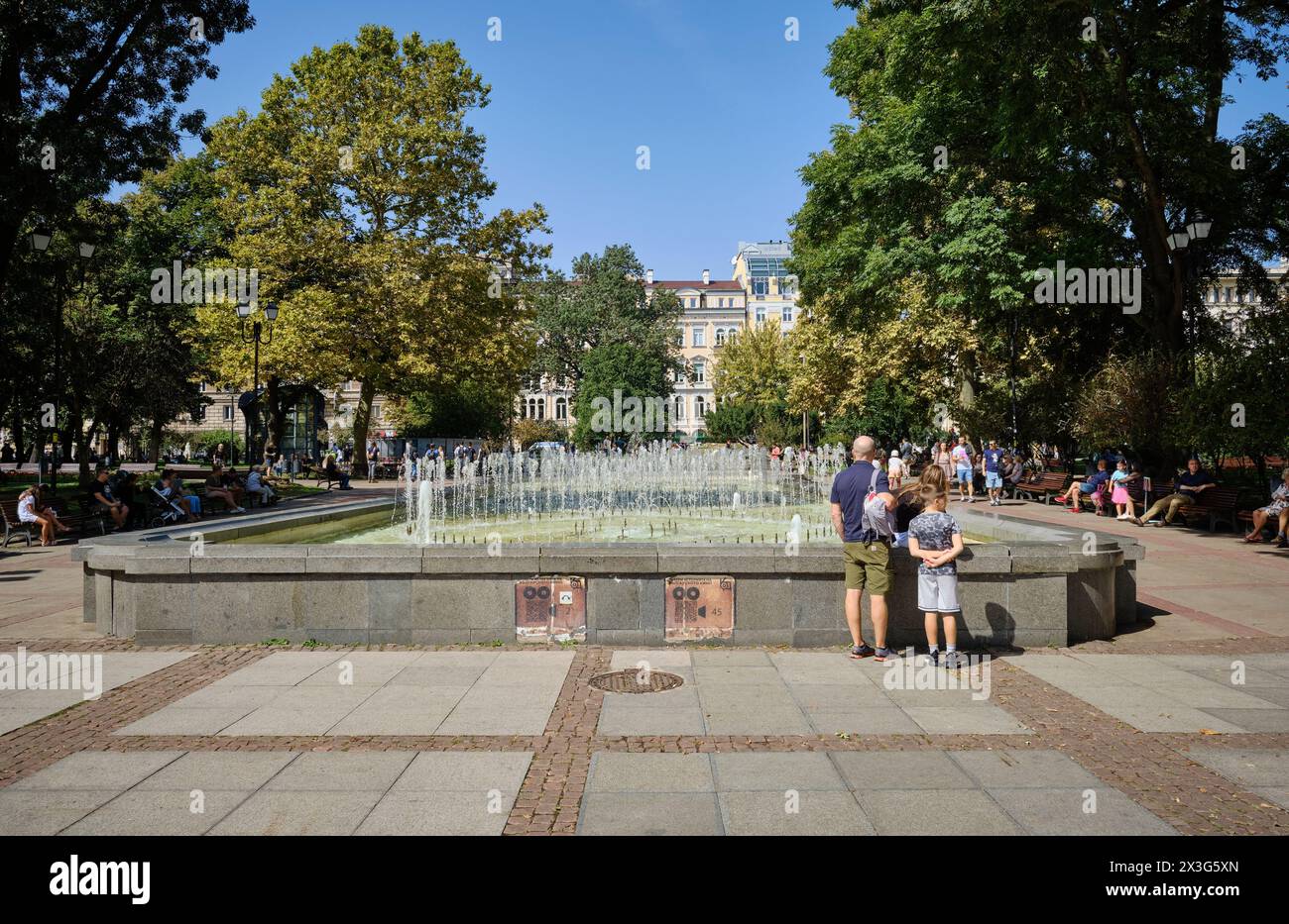 Bulgaria, Sofia; 22 September 2023, people relax by the fountain in the ...