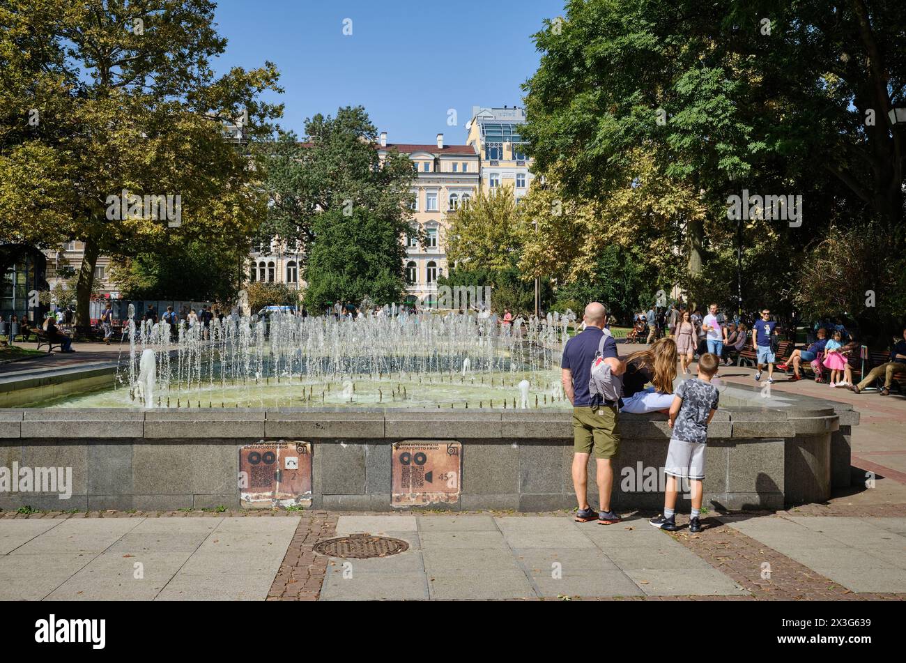 Bulgaria, Sofia; 22 September 2023, people relax by the fountain in the ...