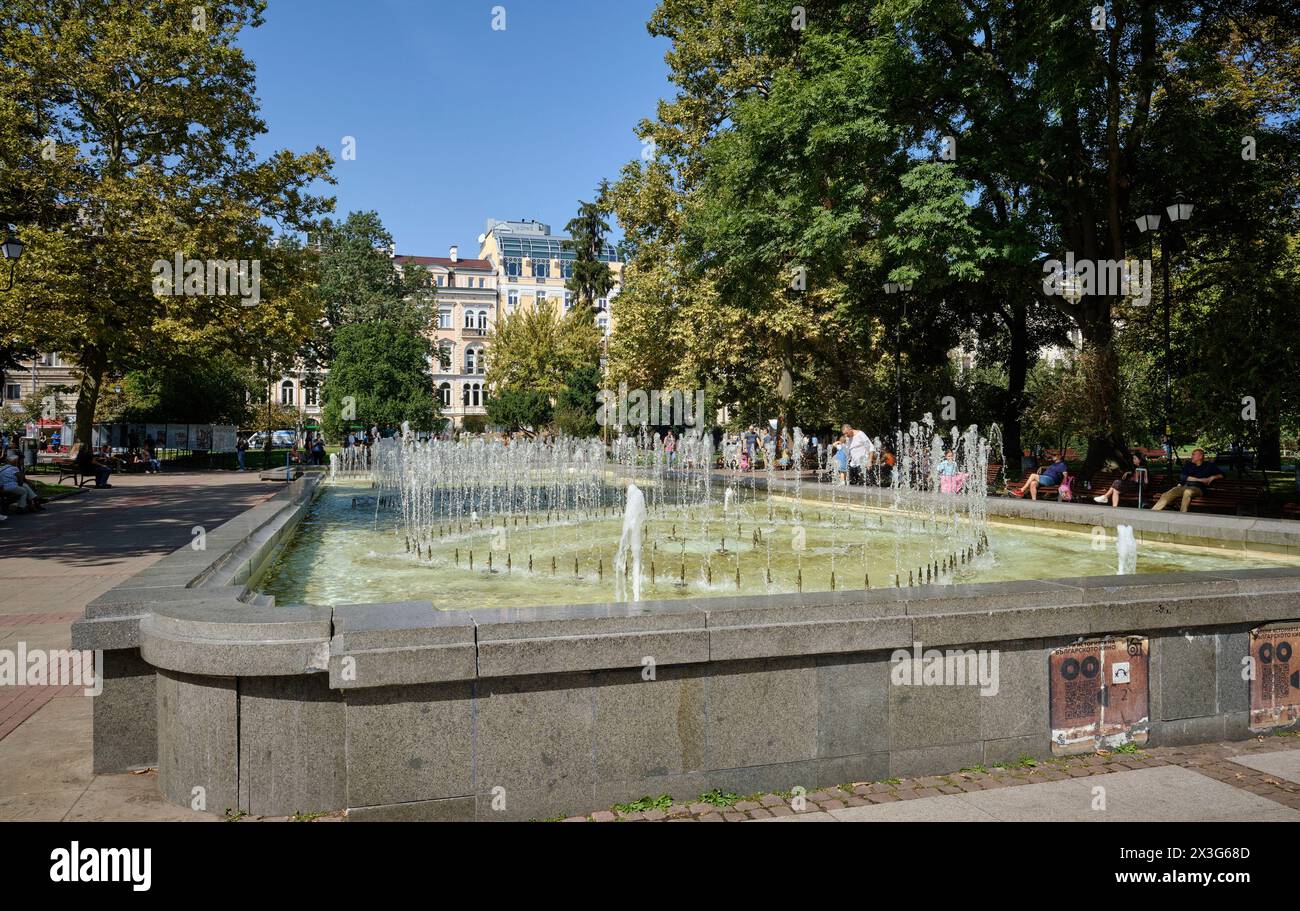 Bulgaria, Sofia; 22 September 2023, people relax by the fountain in the ...