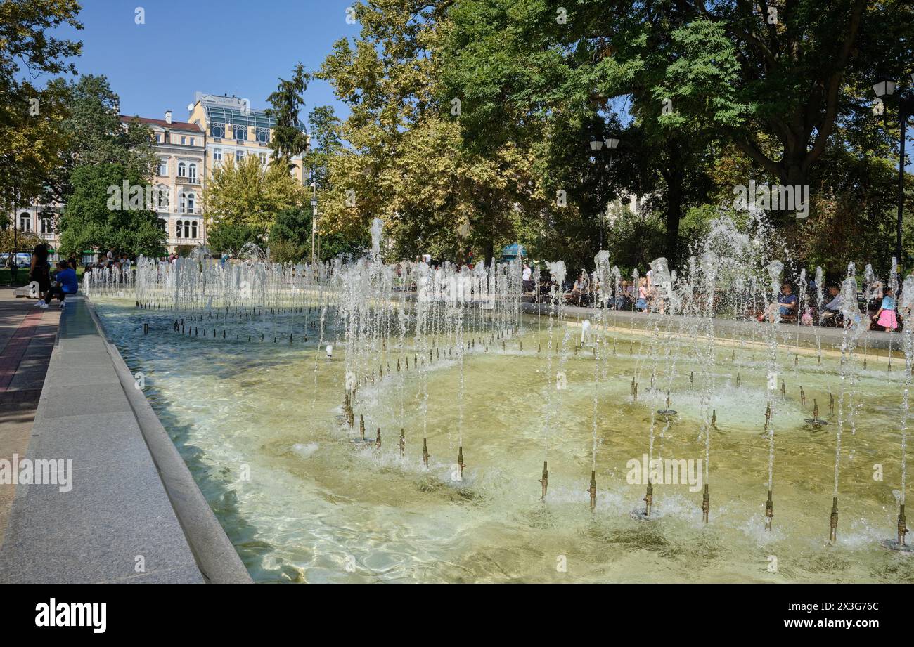 Bulgaria, Sofia; 22 September 2023, people relax by the fountain in the ...