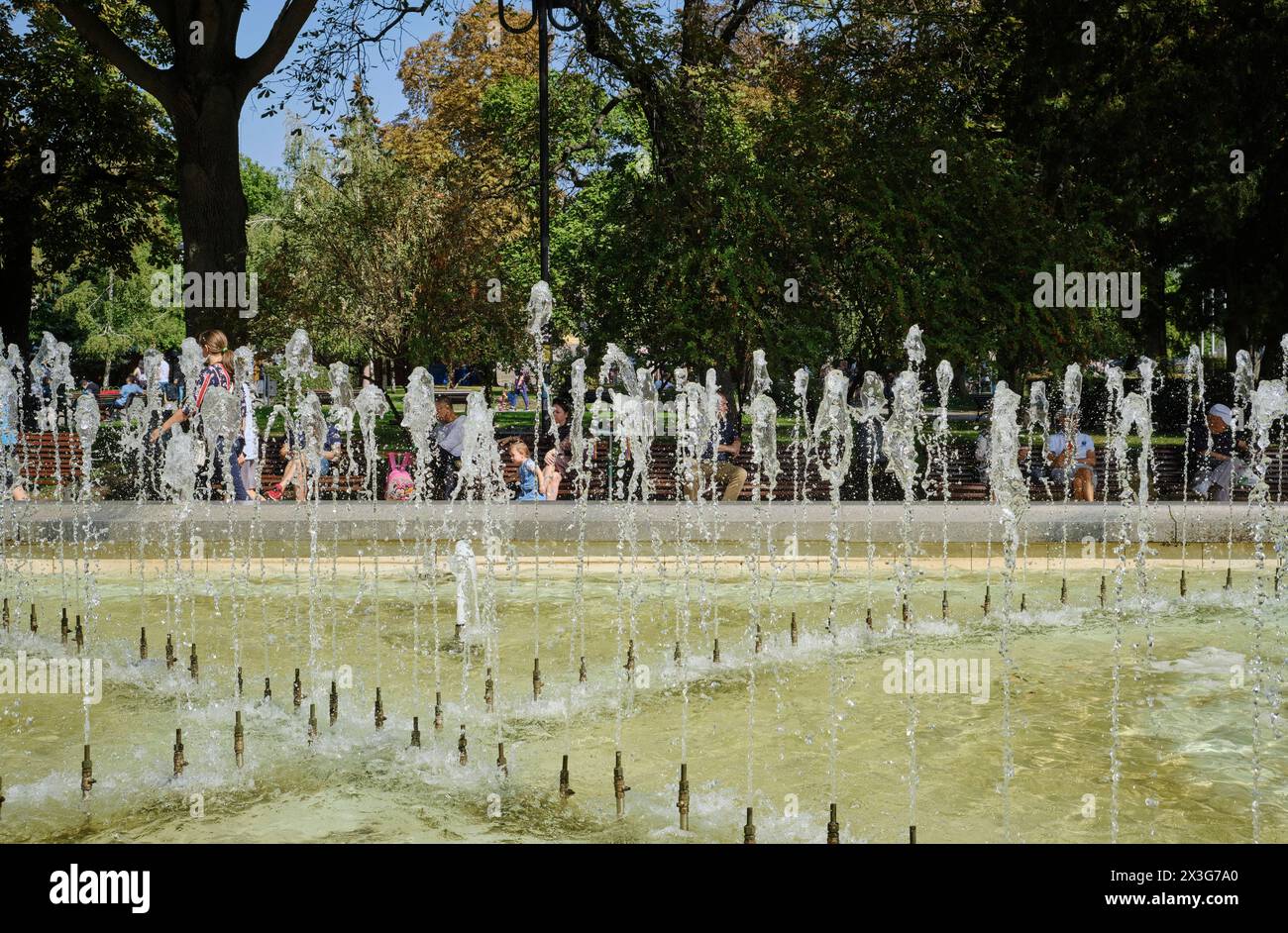 Bulgaria, Sofia; 22 September 2023, people relax by the fountain in the ...