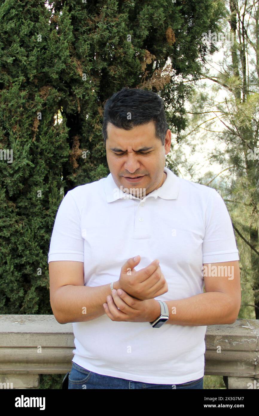 40-year-old dark-skinned Latino man suffering from pain in wrist and ...