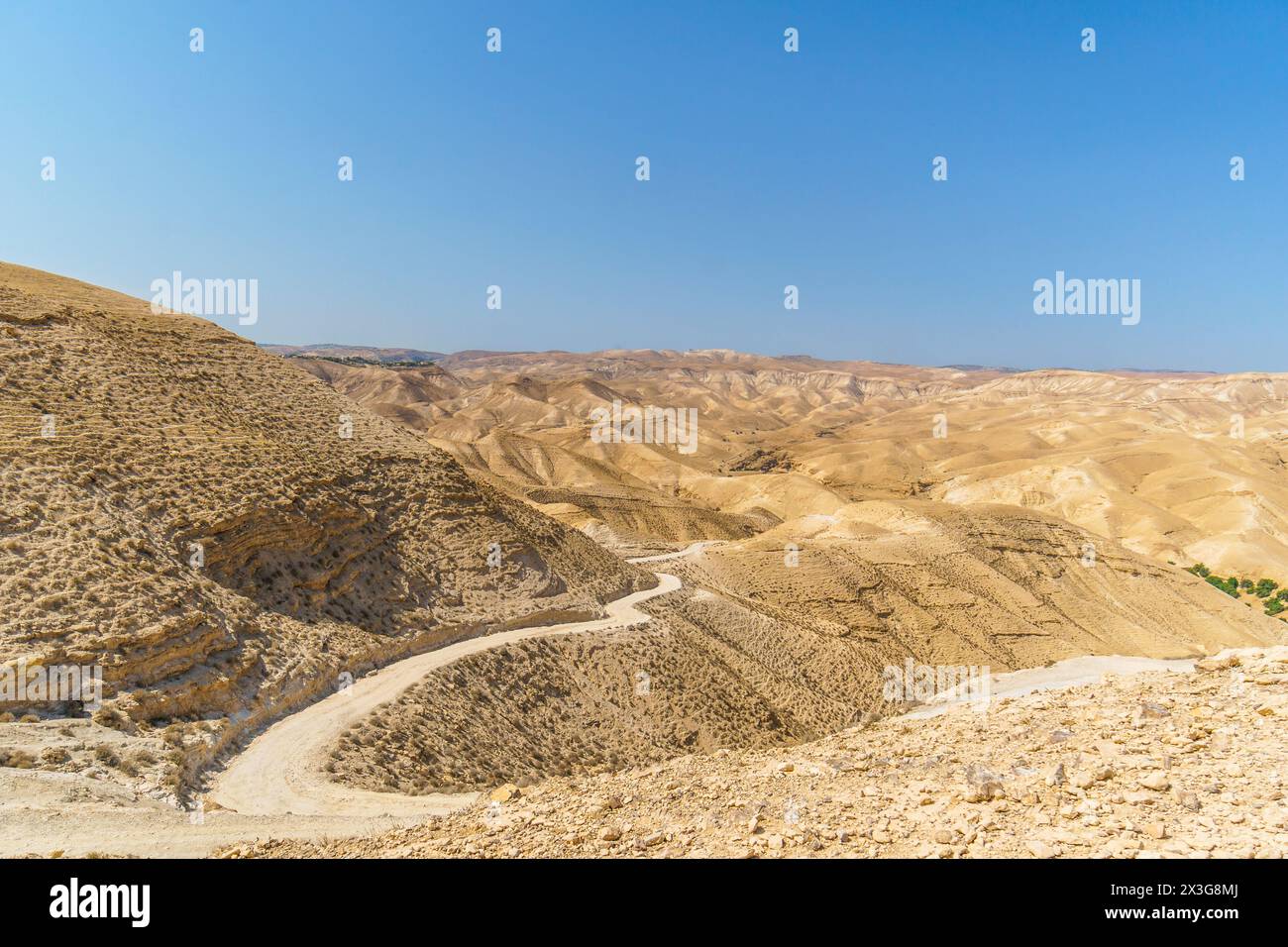 Winding pathway from the Israel mountains through the desert and dunes ...