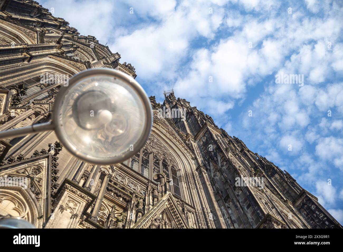 Gazing up at Cologne Cathedral with thin cloud sky, German travel Stock ...