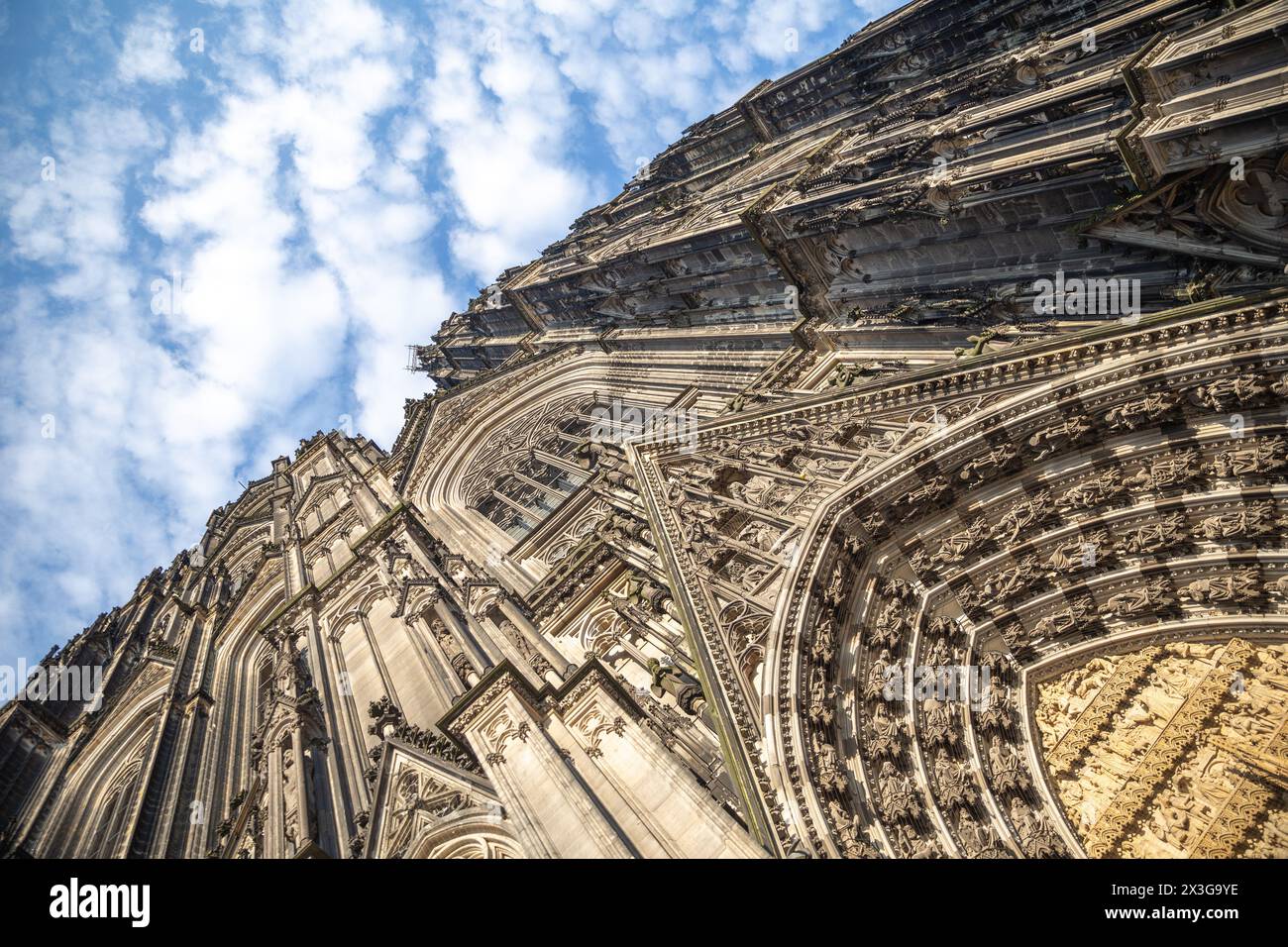 Gazing up at Cologne Cathedral with thin cloud sky, German travel Stock ...