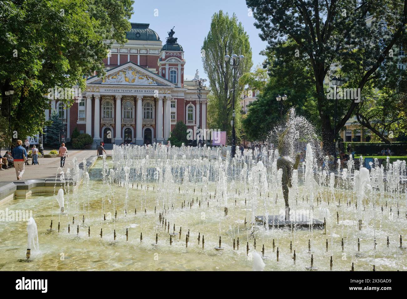 Bulgaria, Sofia; people relax by the fountain in the Gradska Gradina ...