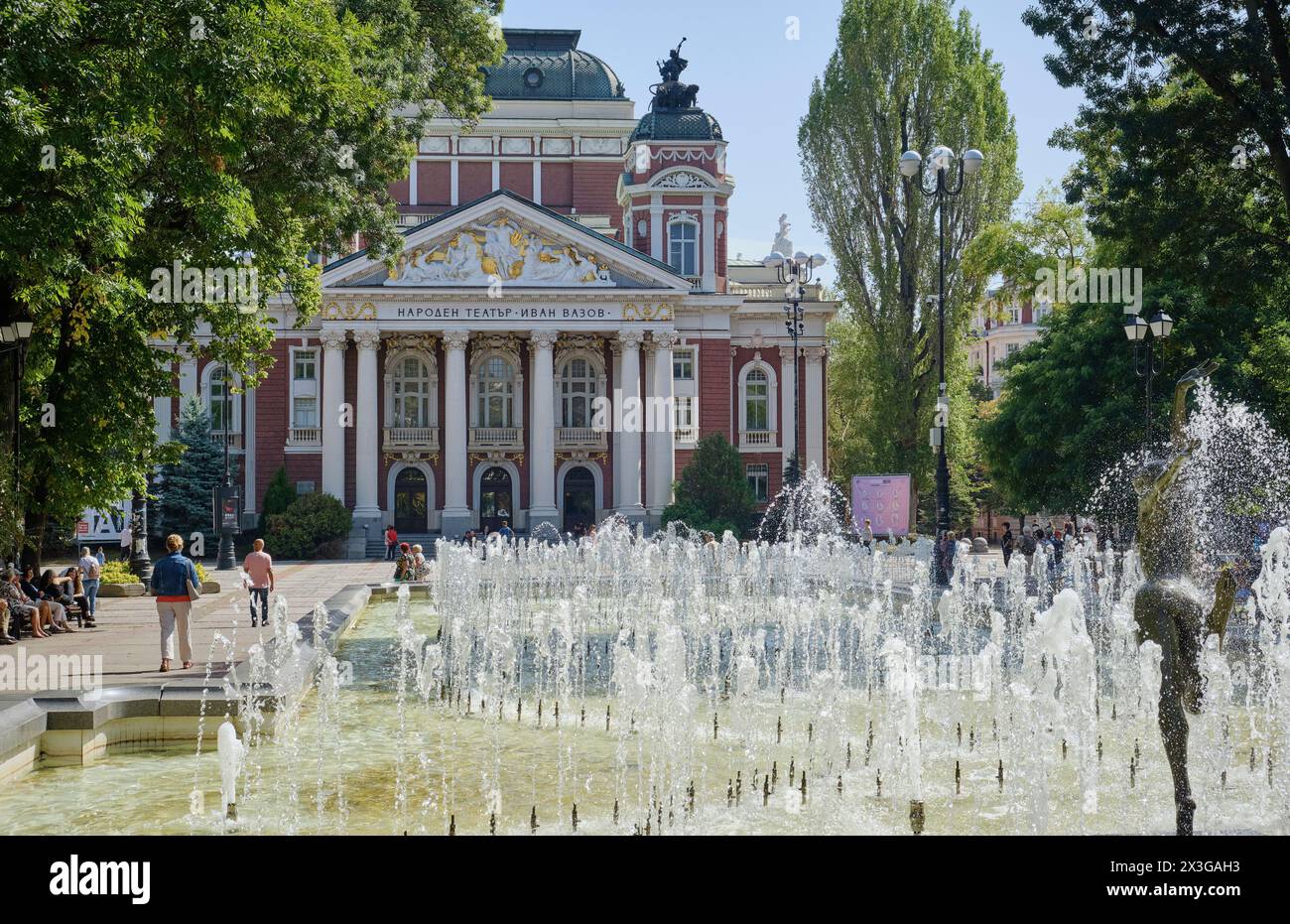Bulgaria, Sofia; people relax by the fountain in the Gradska Gradina ...