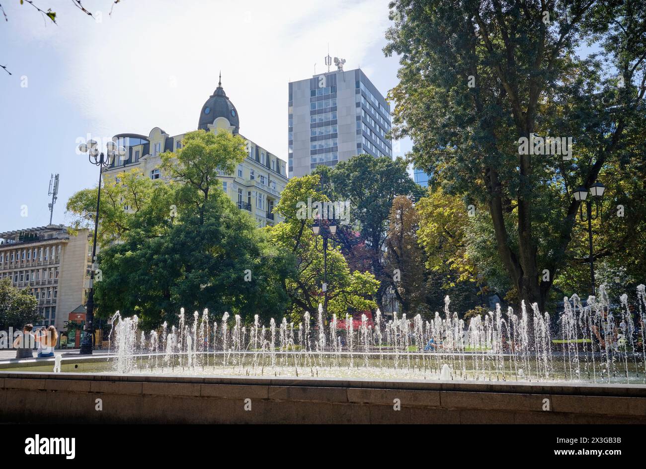 Bulgaria, Sofia; 22 September 2023, people relax by the fountain in the ...