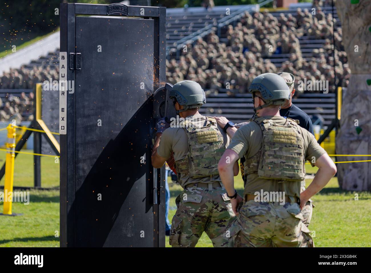 A U.S. Soldier uses a saw during a breaching event at the David E ...