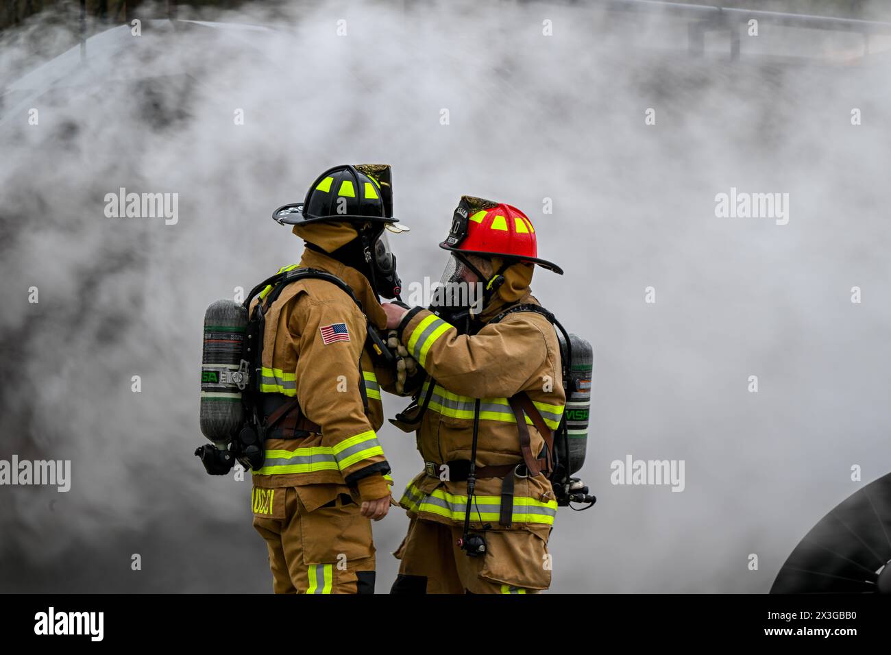 Youngstown Air Reserve Station fire captain John West helps firefighter ...