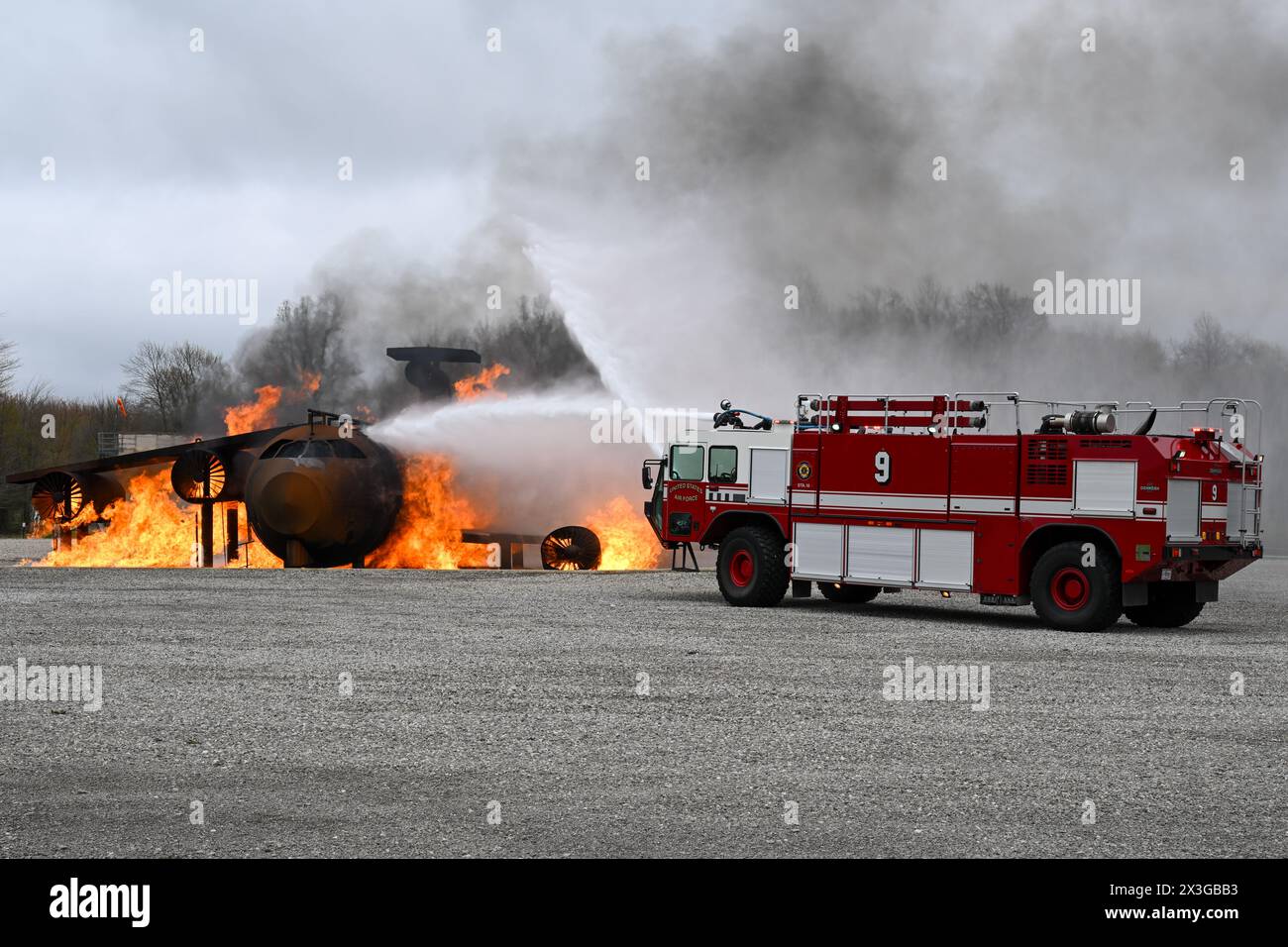 Fire engine 9 sprays water on a mock aircraft crash at the firefighter ...