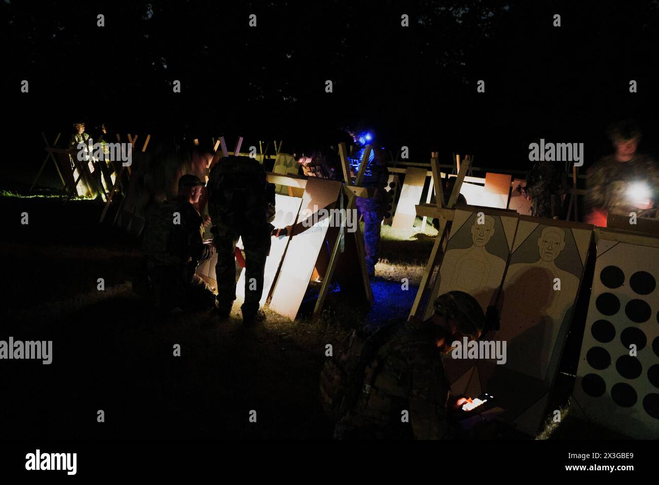 On day three, marksmen tested their skills during the first night shoot ...