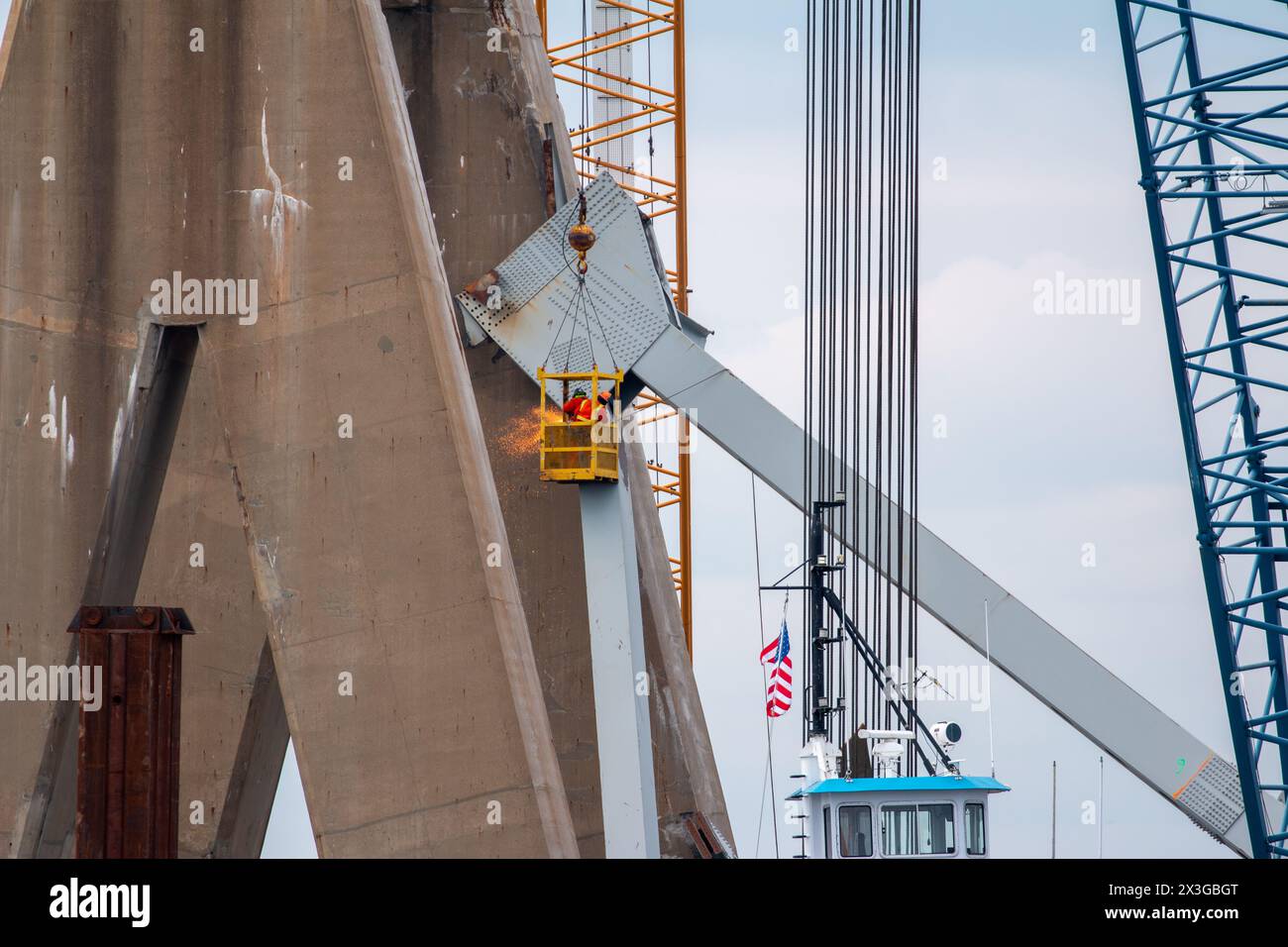 Salvage crews continue work clearing the wreckage of the Francis Scott ...