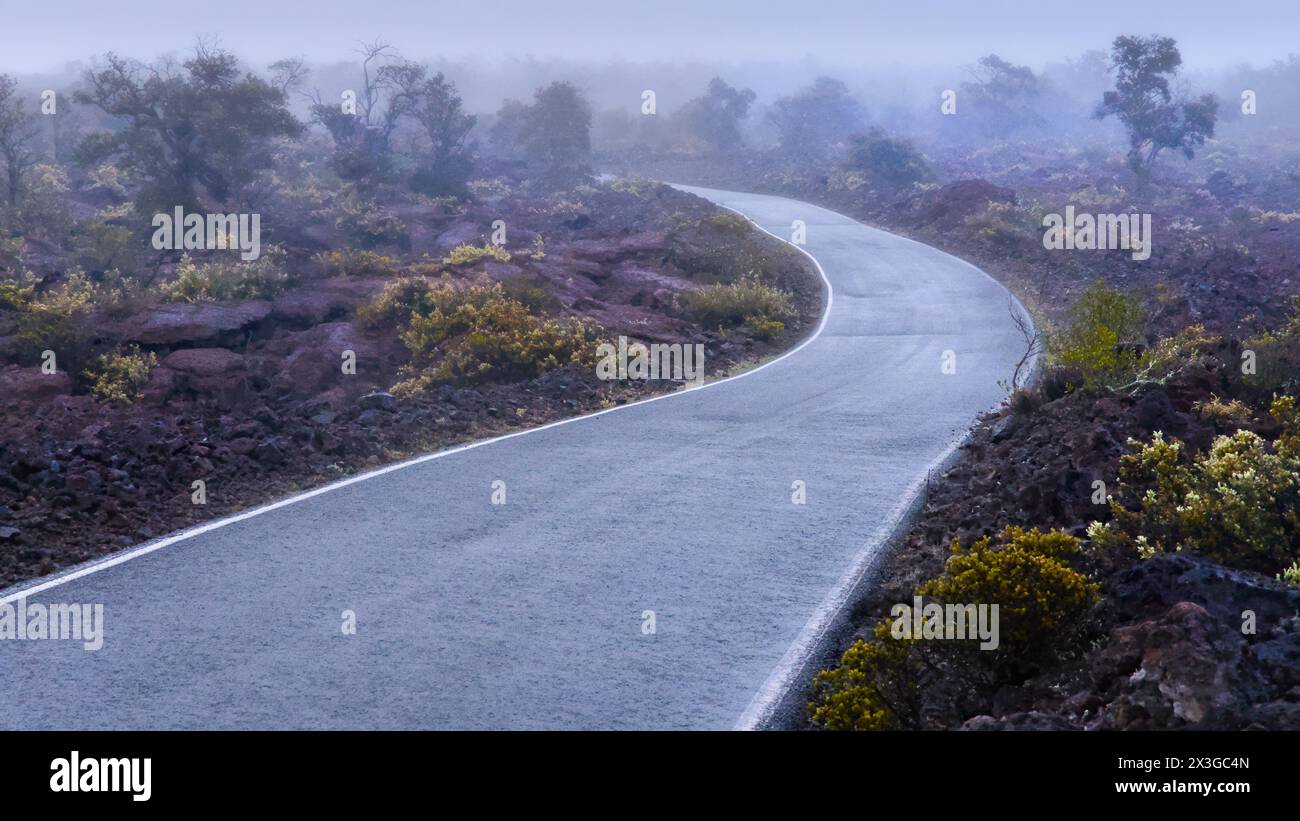 One way curved road goes through lava bed in Big Island, Hawaii Stock ...