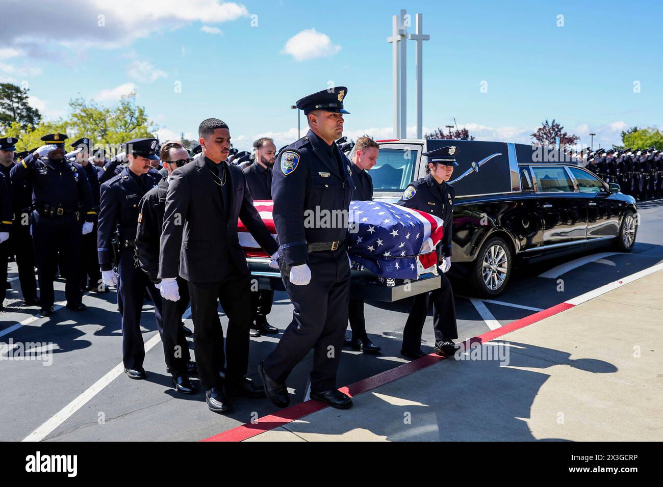 Pallbearers guide the casket of Oakland police officer Jordan Wingate ...