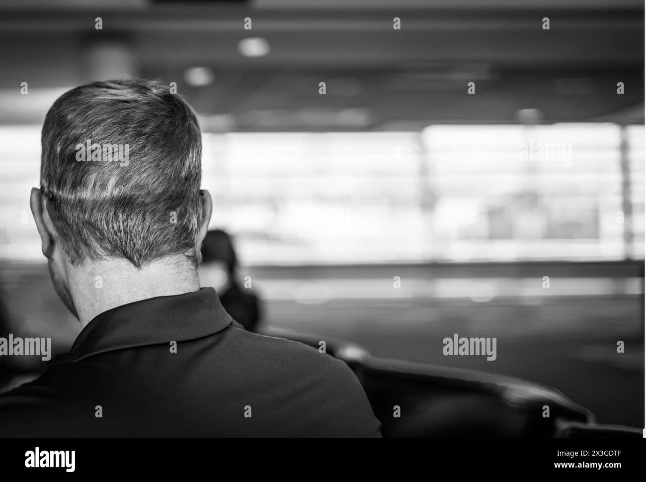 Selective focus on the back of an adult male with hat-hair caused by ...