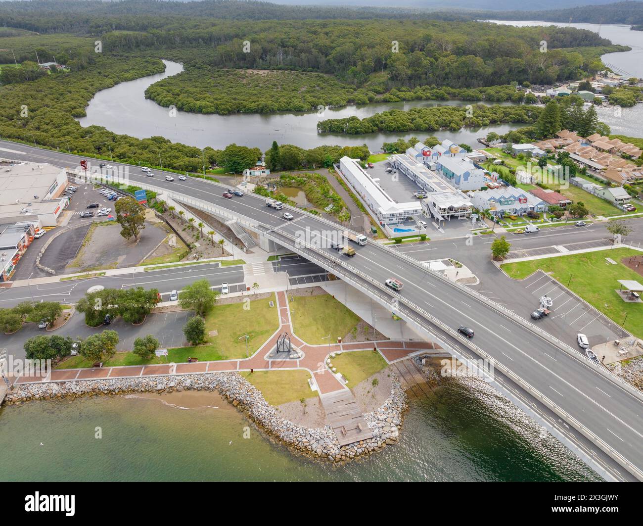 Aerial view of a freeway exit ramp over an esplanade with a winding ...