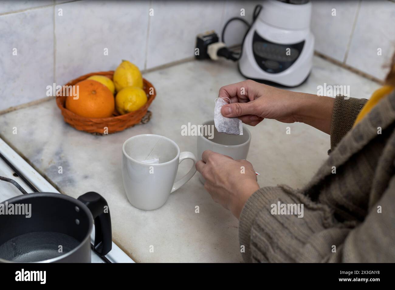 unrecognizable woman making tea Stock Photo - Alamy