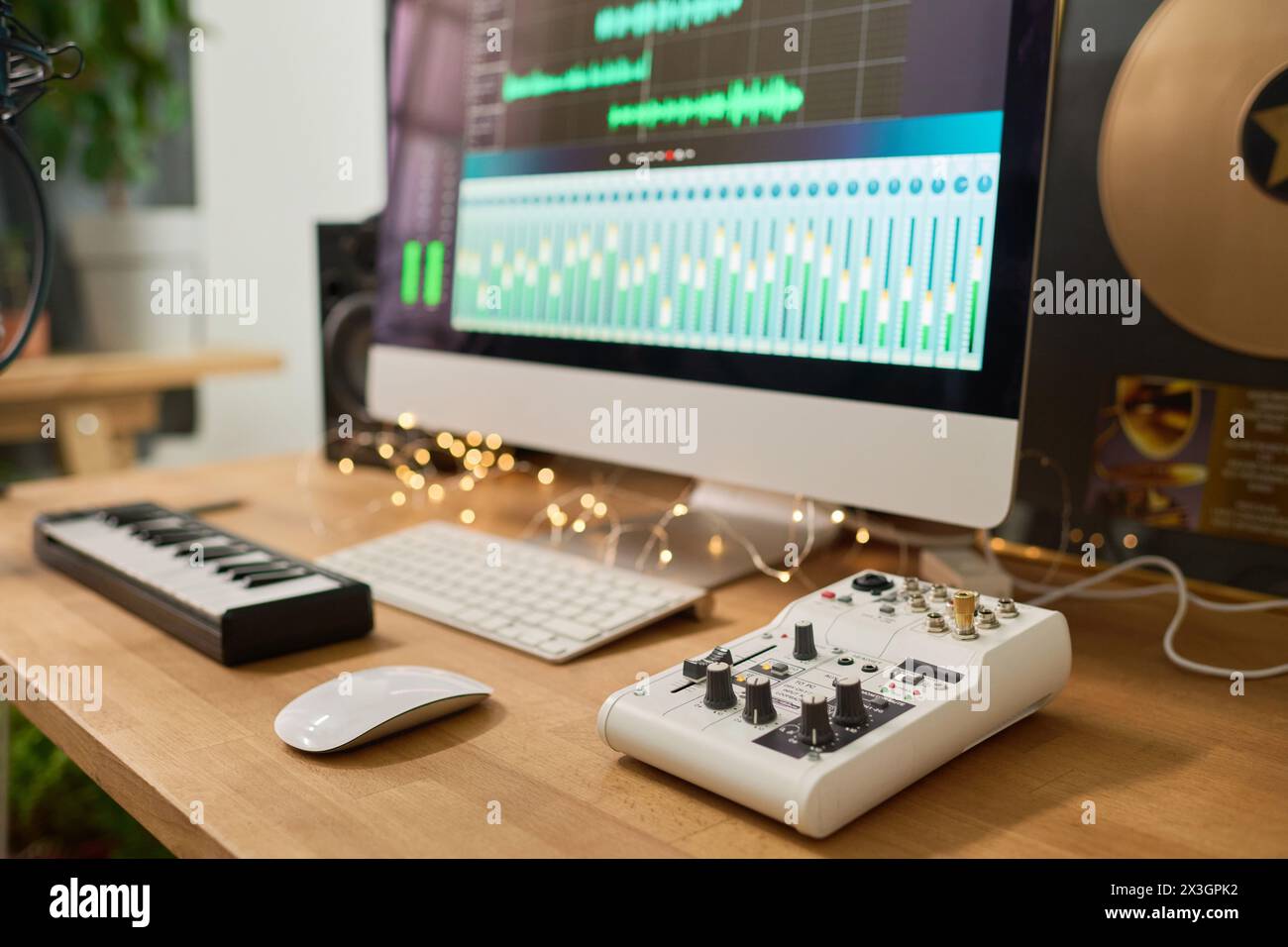 Sound recording equipment with consoles standing on workplace of modern ...