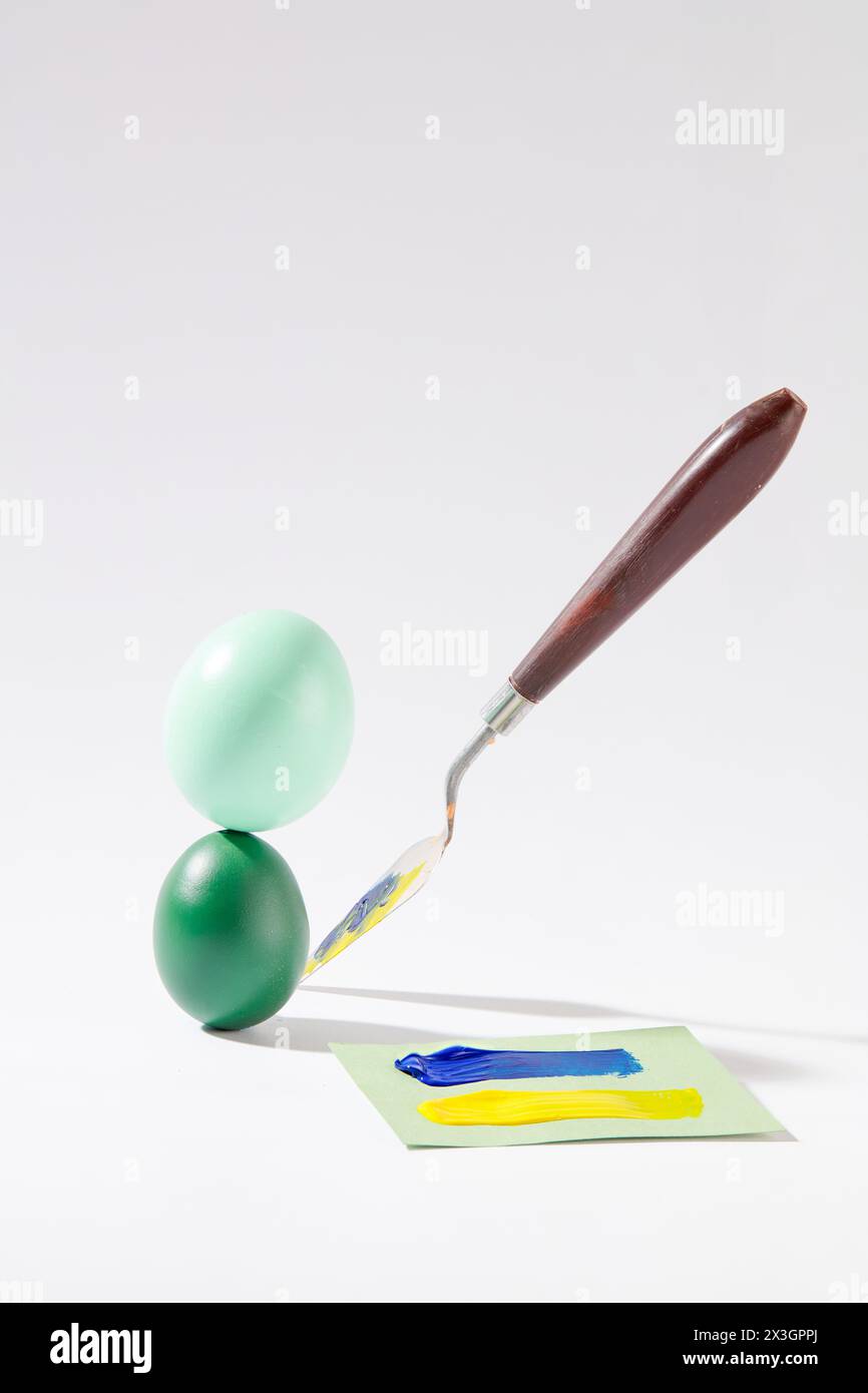 Easter Day concept with a stack of Easter eggs decorated with a palette ...