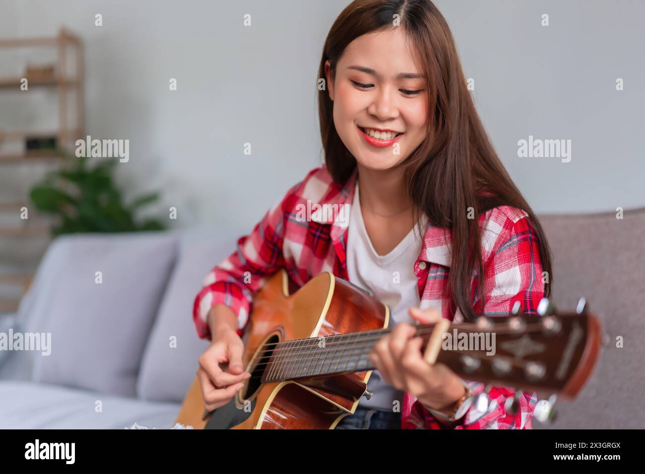 Guitar and singer concept, Young woman learning and practice playing ...