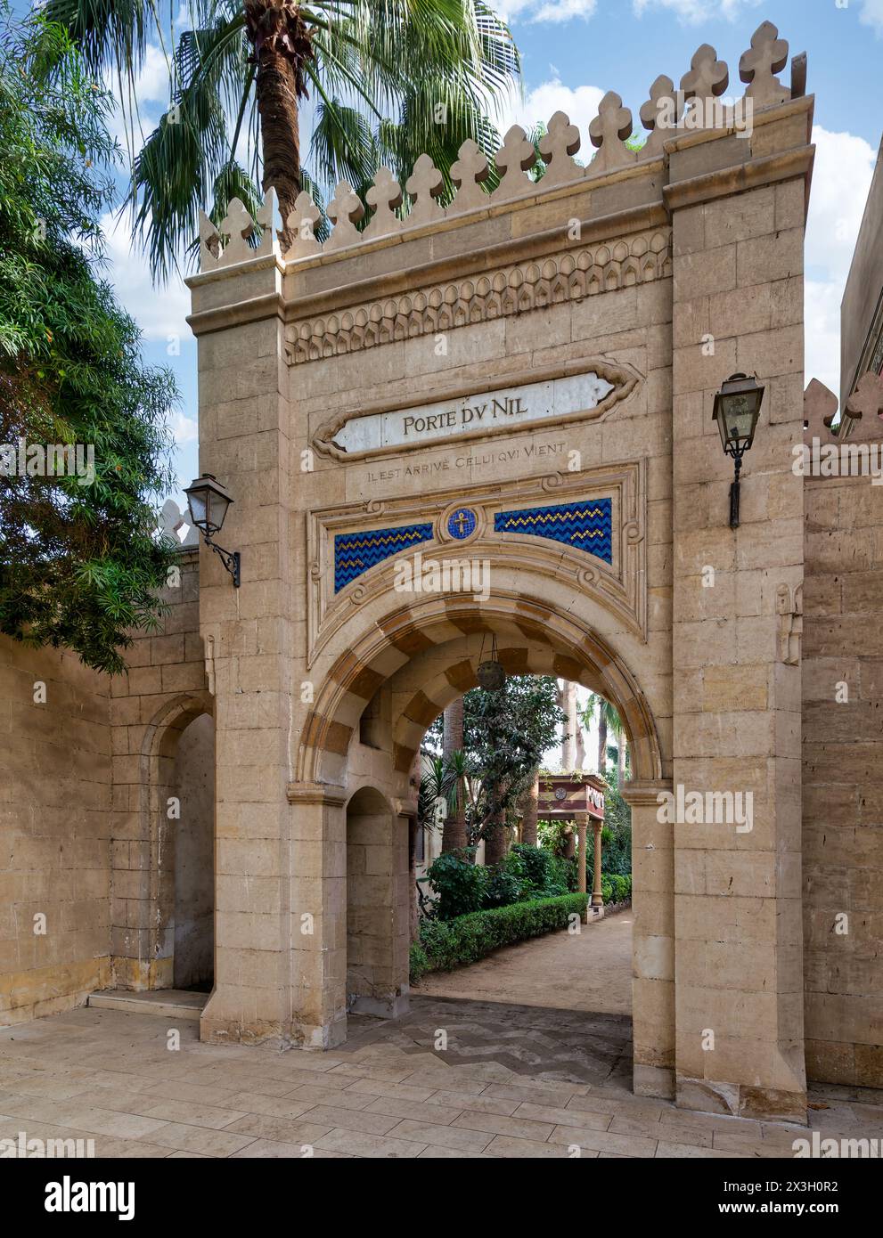 An ornate Mamluk-style archway leads to a tranquil garden at Prince ...