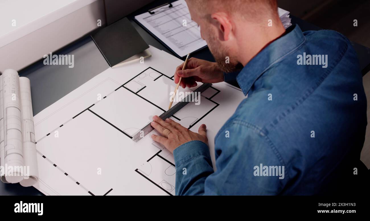 Architect Engineer Drawing Architectural Construction Plan In Office ...