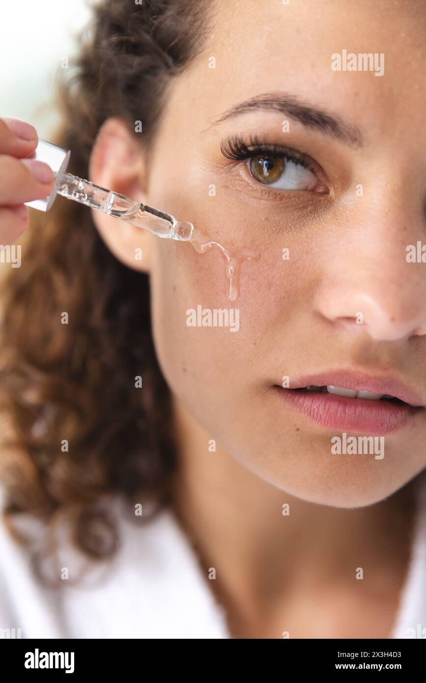 Woman serum face applying hi-res stock photography and images - Alamy