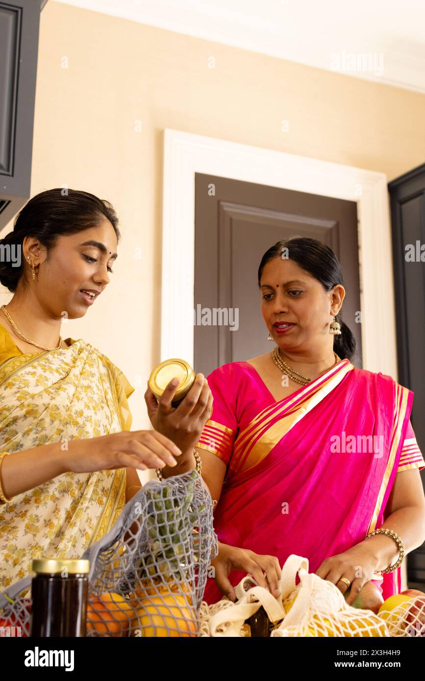 Indian mother and teenage daughter wearing traditional clothes ...