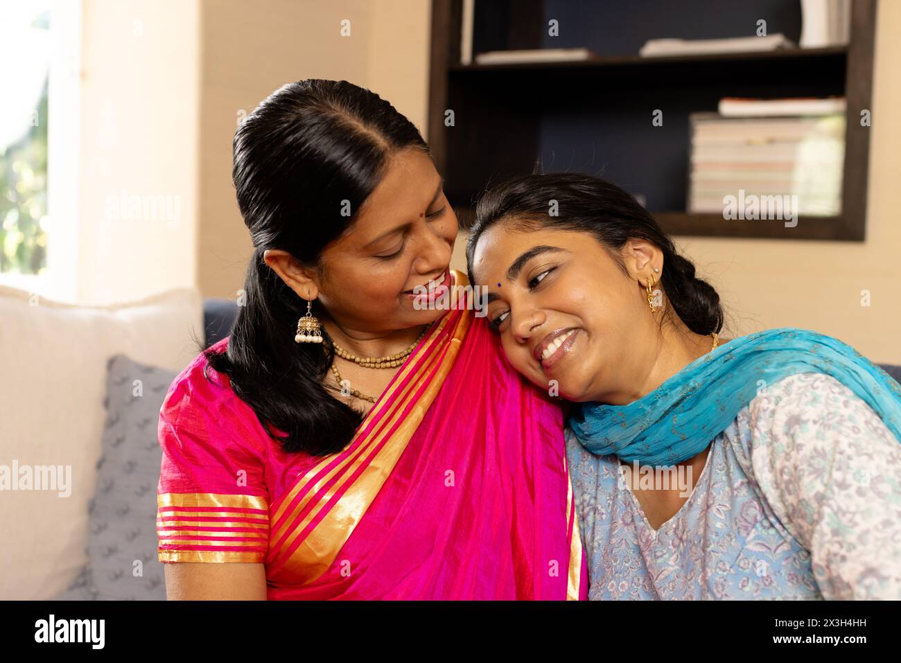 Indian mother and teenage daughter, sharing loving moment at home Stock ...