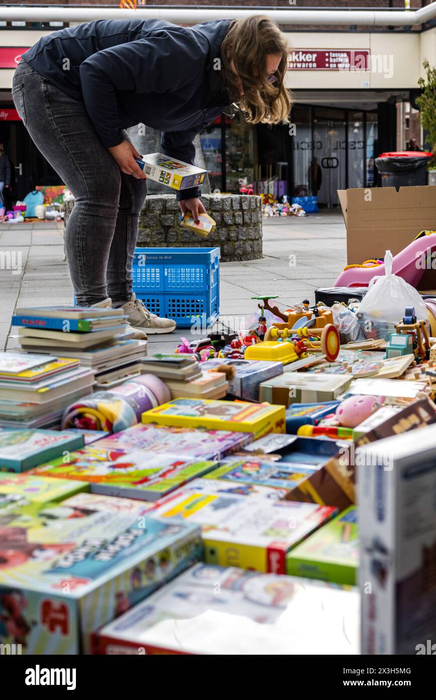 VELDHOVEN - People prepare for the flea market during the celebration ...