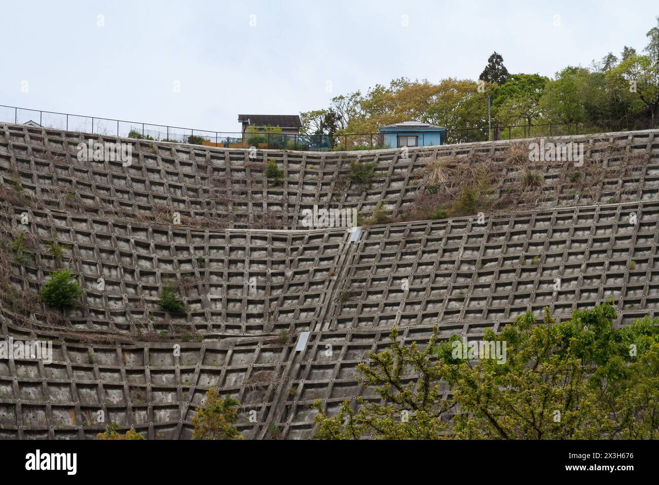 A concrete reinforced hillside near Sagami lake in rural Kanagawa ...