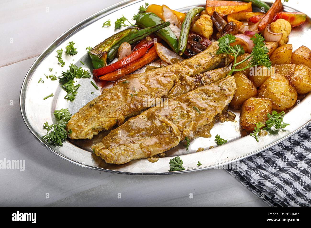 Roasted shark steak with potato and vegetable garnish Stock Photo - Alamy