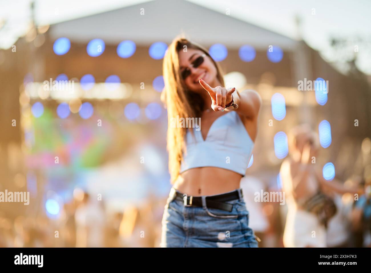 Happy millennial lady points hi-res stock photography and images - Alamy