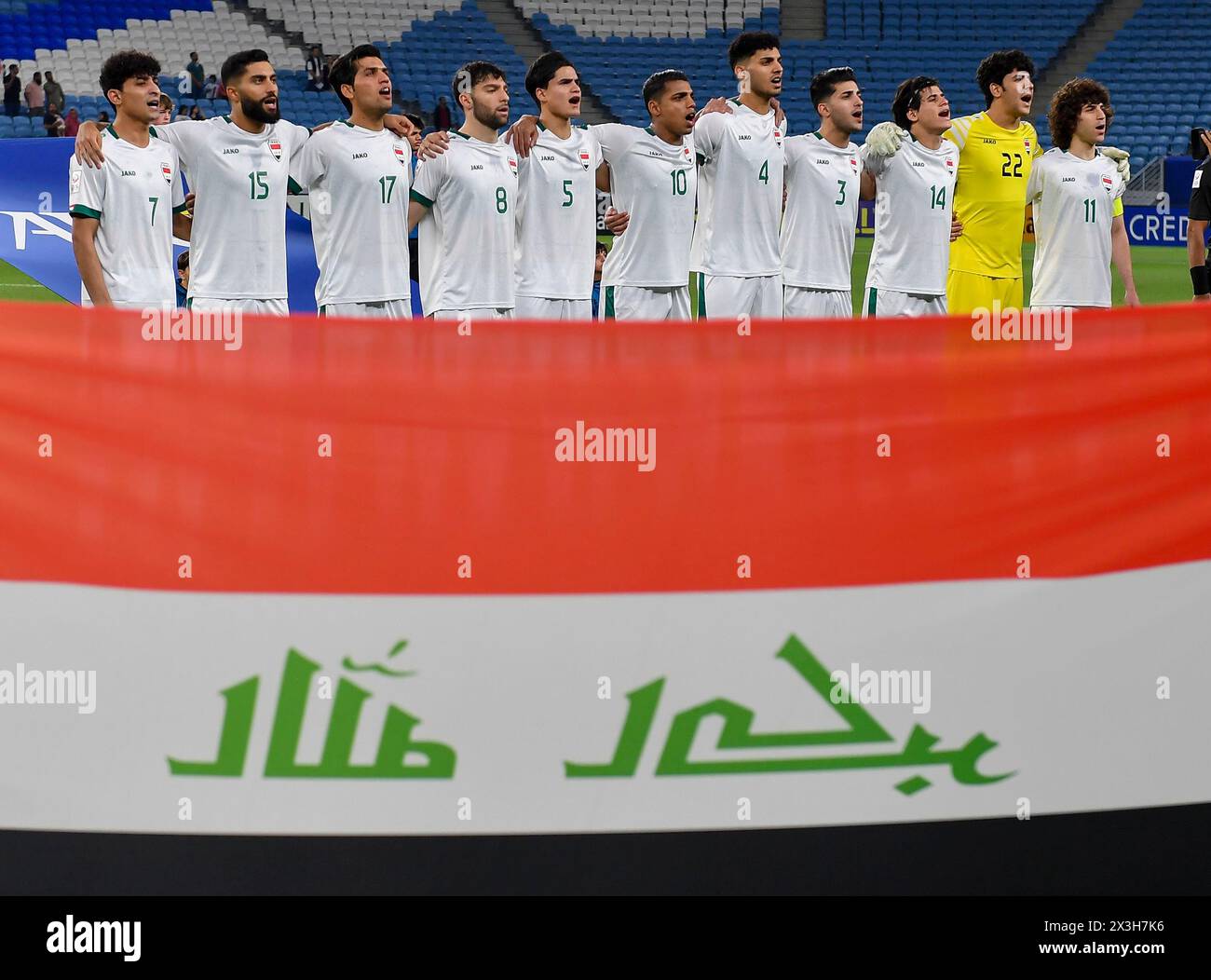 Doha, Qatar. 26th Apr, 2024. Players of Iraq line up prior to the ...