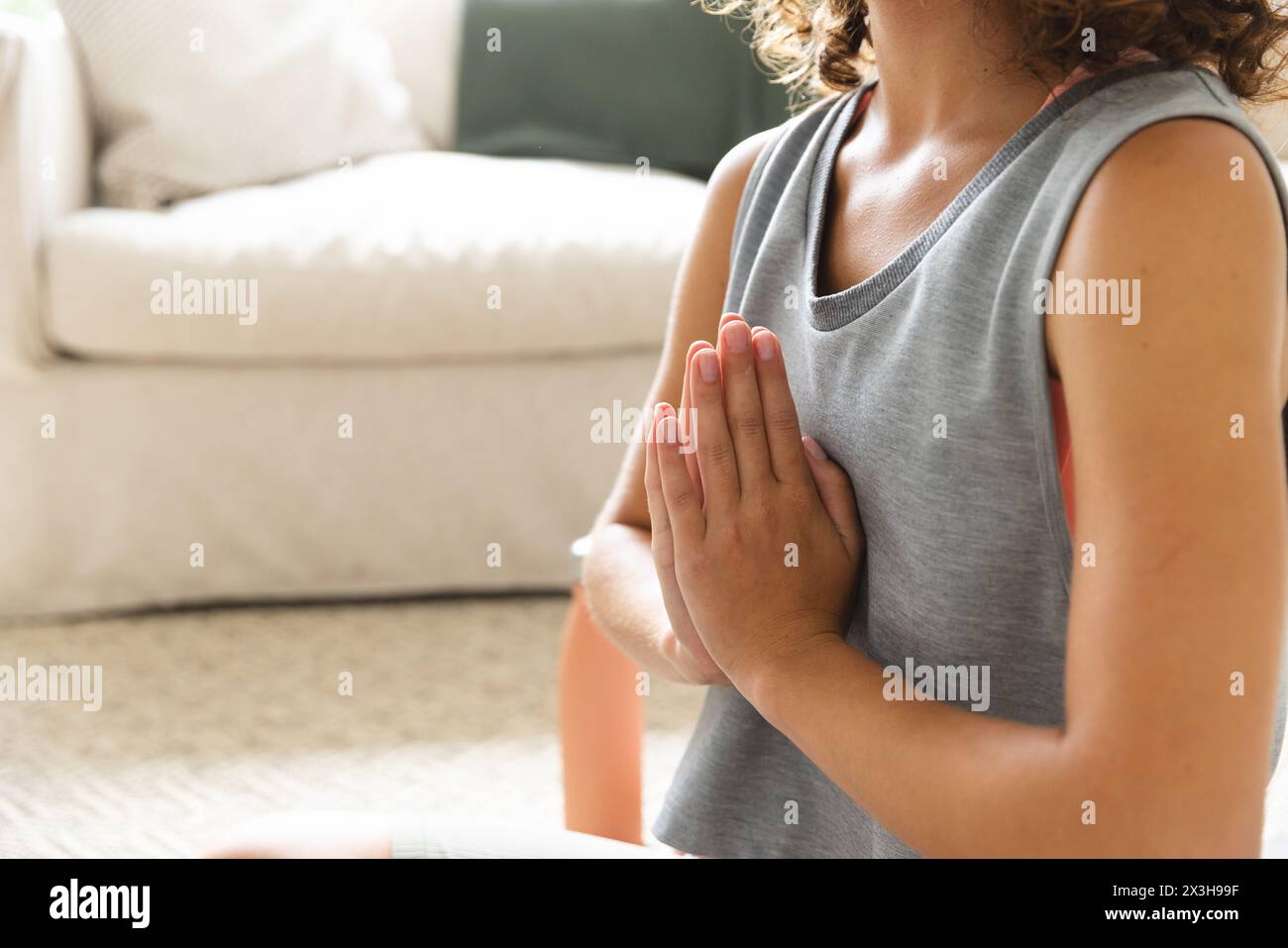 Woman pressing hands together hi-res stock photography and images - Alamy