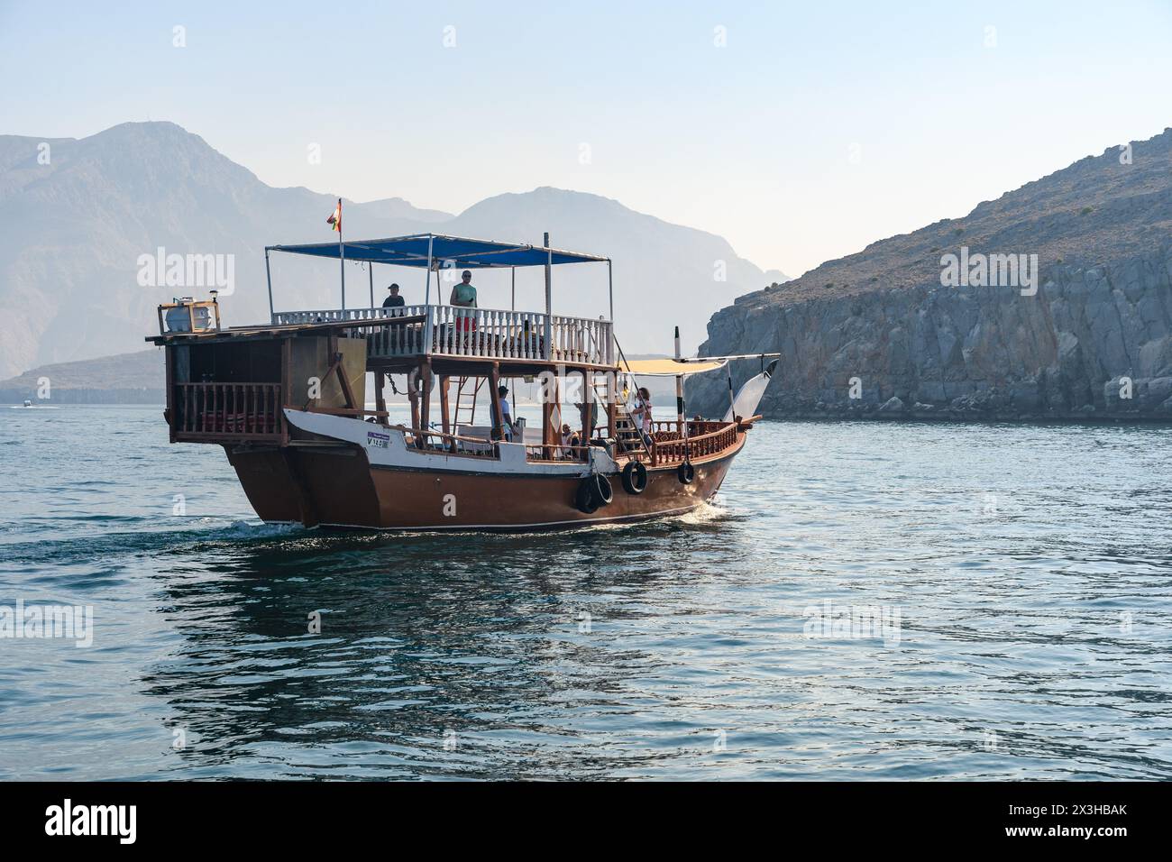 Khasab, Oman - 1 January 2024: Tourists embark on a serene boat ride ...