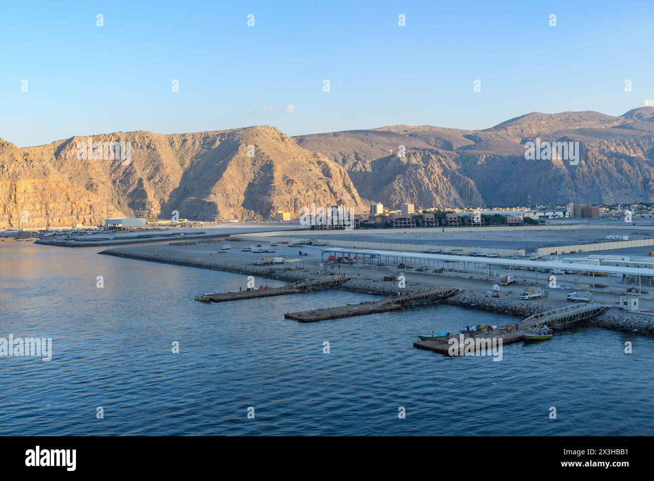 Khasab, Oman - 1 January 2024: The golden hour casts a serene glow over ...